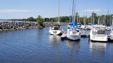 Small pretty white boat arriving to the ... | Stock Video | Pond5