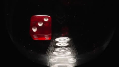 Small red dice falling into empty glass ... | Stock Video | Pond5