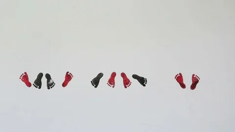 small red footsteps appear on white back... | Stock Video | Pond5