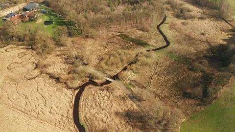 Small river wiggles through dry landscap... | Stock Video | Pond5