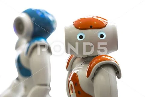 Small robots with human face and body. AI Small robots with human face ...