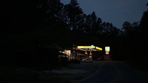Small, rural gas station, illuminated at... | Stock Video | Pond5