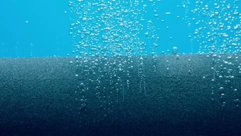 Small shiny air bubbles escaping from gr... | Stock Video | Pond5
