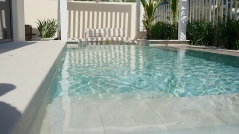 Small swimming pool with canopy and sofa... | Stock Video | Pond5
