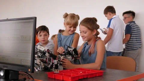 Smart children makes a robot from the ro... | Stock Video | Pond5