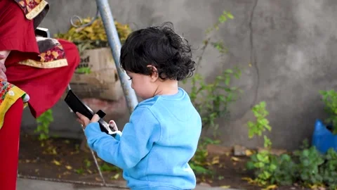 Smart Indian boy child taking mobile pho... | Stock Video | Pond5