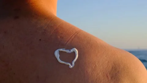 Smear sunscreen in the shape of heart on... | Stock Video | Pond5