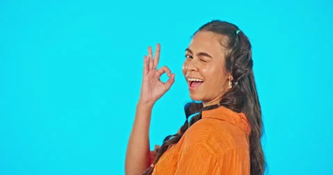 Smile, wink and okay hand gesture, woman... | Stock Video | Pond5