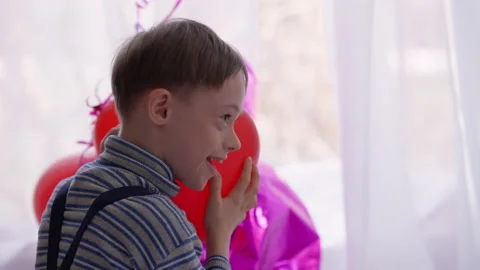 Smiling autistic curios boy playing with... | Stock Video | Pond5