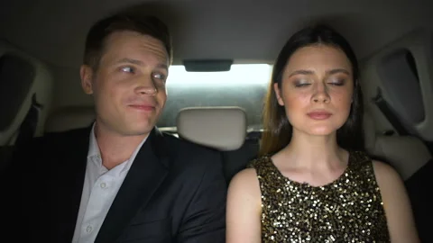 Smiling celebrities sitting on back seat... | Stock Video | Pond5