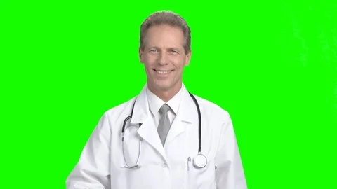 Smiling doctor with syringe, green scree... | Stock Video | Pond5
