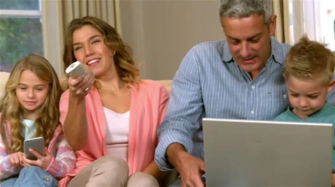 Smiling family using technology | Stock Video | Pond5