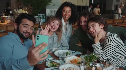 Smiling friends talking by video call on... | Stock Video | Pond5