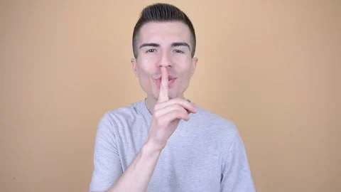 Smiling Handsome Man Makes 'Shh' Gesture... | Stock Video | Pond5