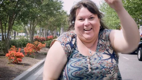 Smiling happy full figured celebrating s... | Stock Video | Pond5