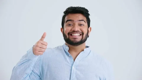 Smiling Indian man with piercing showing... | Stock Video | Pond5