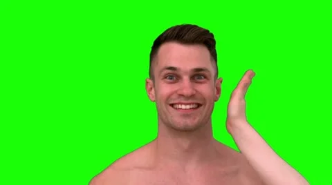 Smiling man taking a slap on green backg... | Stock Video | Pond5