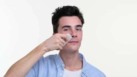 Smiling Man Using Gua Sha Tool for Facia... | Stock Video | Pond5