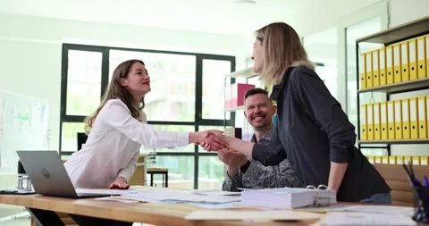 Smiling manager shaking hands with succe... | Stock Video | Pond5