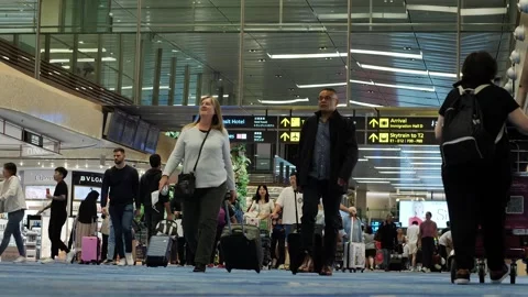 Smiling passengers at Changi Singapore a... | Stock Video | Pond5