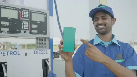 Smiling petrol pump worker showing green... | Stock Video | Pond5