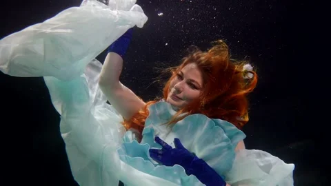 smiling redhead mermaid floating underwa... | Stock Video | Pond5