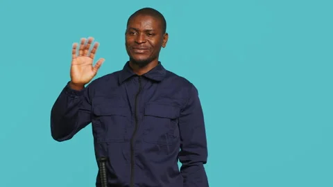 Smiling security guard saluting people, ... | Stock Video | Pond5