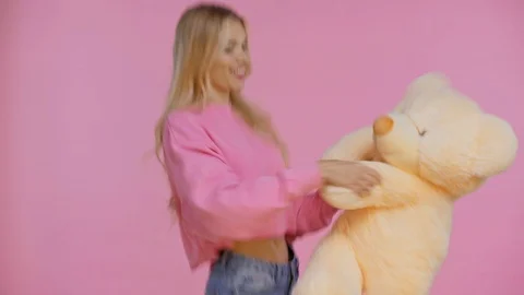 smiling woman dancing with teddy bear is... | Stock Video | Pond5