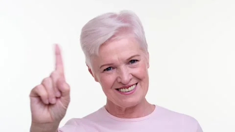 Smiling Woman Wagging Finger on White Ba... | Stock Video | Pond5