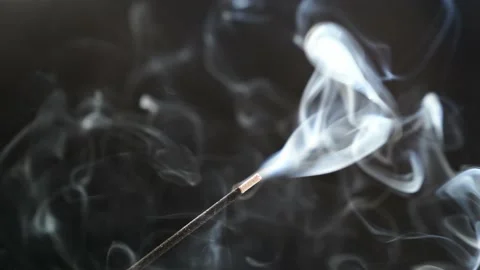 smoke from an aromatic stick on a black ... | Stock Video | Pond5