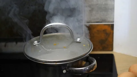smoke comes coming out of the pan cookin... | Stock Video | Pond5