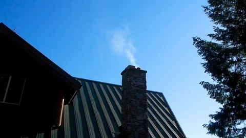 smoke coming out of chimney with blue sk... | Stock Video | Pond5