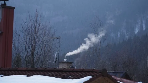 Smoke coming out of chimney from the hou... | Stock Video | Pond5