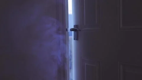 Smoke coming out of a room with an open ... | Stock Video | Pond5