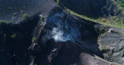 Smoke coming out of volcano crater | Stock Video | Pond5