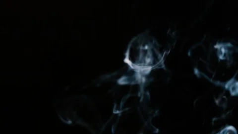 Smoke curled up on a black background | Stock Video | Pond5