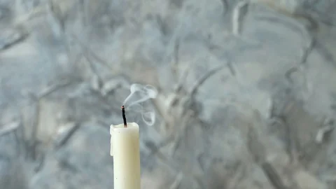 Smoke from an extinct candle on gray bac... | Stock Video | Pond5