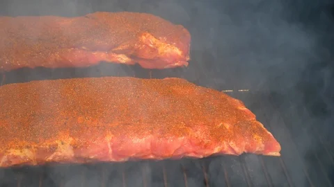 Smoking ribs on the backyard grill - sli... | Stock Video | Pond5