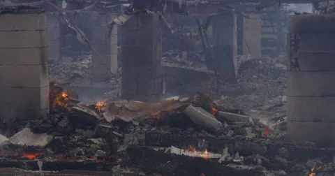 Smoldering rubble around the foundation ... | Stock Video | Pond5