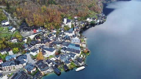 Smooth flight over the village of Hallst... | Stock Video | Pond5