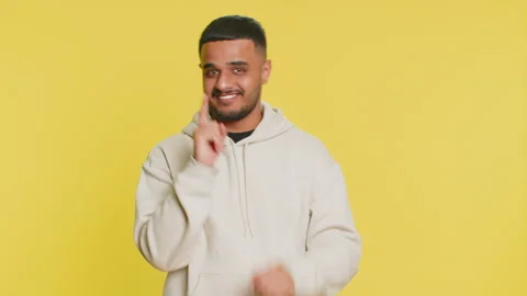 Sneaky cunning Indian young man thinking... | Stock Video | Pond5