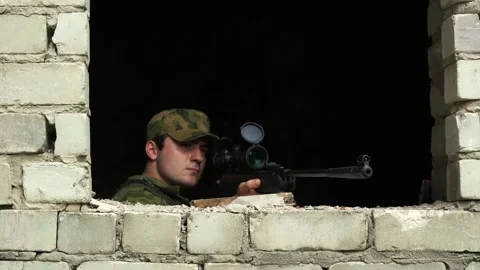 sniper aim with a sniper rifle looking o... | Stock Video | Pond5