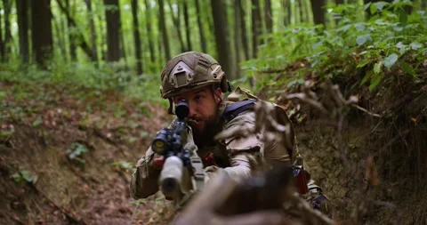 sniper in combat pose walks with a rifle... | Stock Video | Pond5