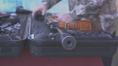 sniper rifle in a case and sniper hands | Stock Video | Pond5