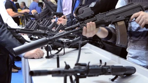 Sniper rifle Submachine Gun on the table | Stock Video | Pond5