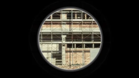 Sniper scope building scaffolding | Stock Video | Pond5