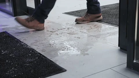 Snow and slush on wet and slippery tiles... | Stock Video | Pond5