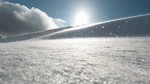 Snow drift flying through the air on the... | Stock Video | Pond5