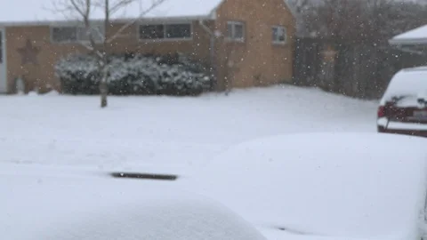 Snow falling with neighborhood backgroun... | Stock Video | Pond5