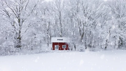 Snow falling outside picturesque red cab... | Stock Video | Pond5